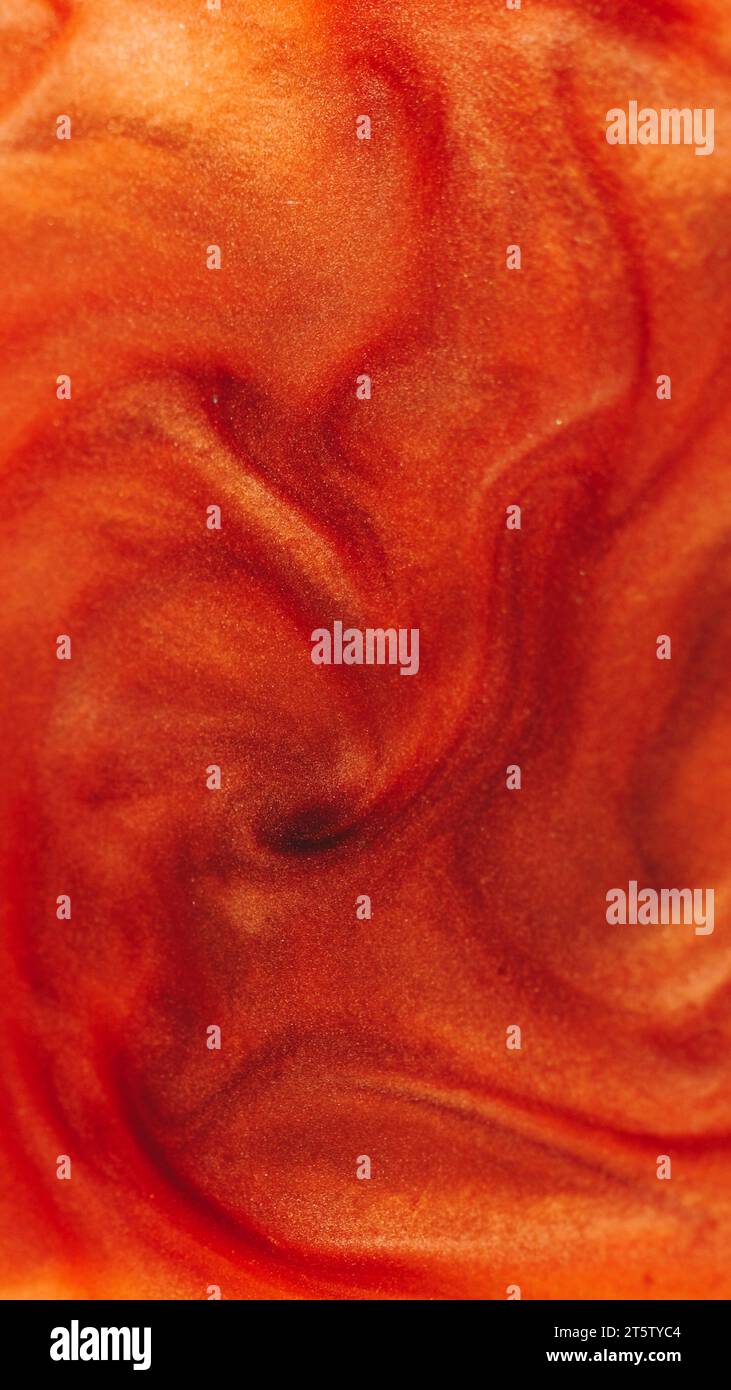 Abstract background glitter liquid flow orange art Stock Photo - Alamy