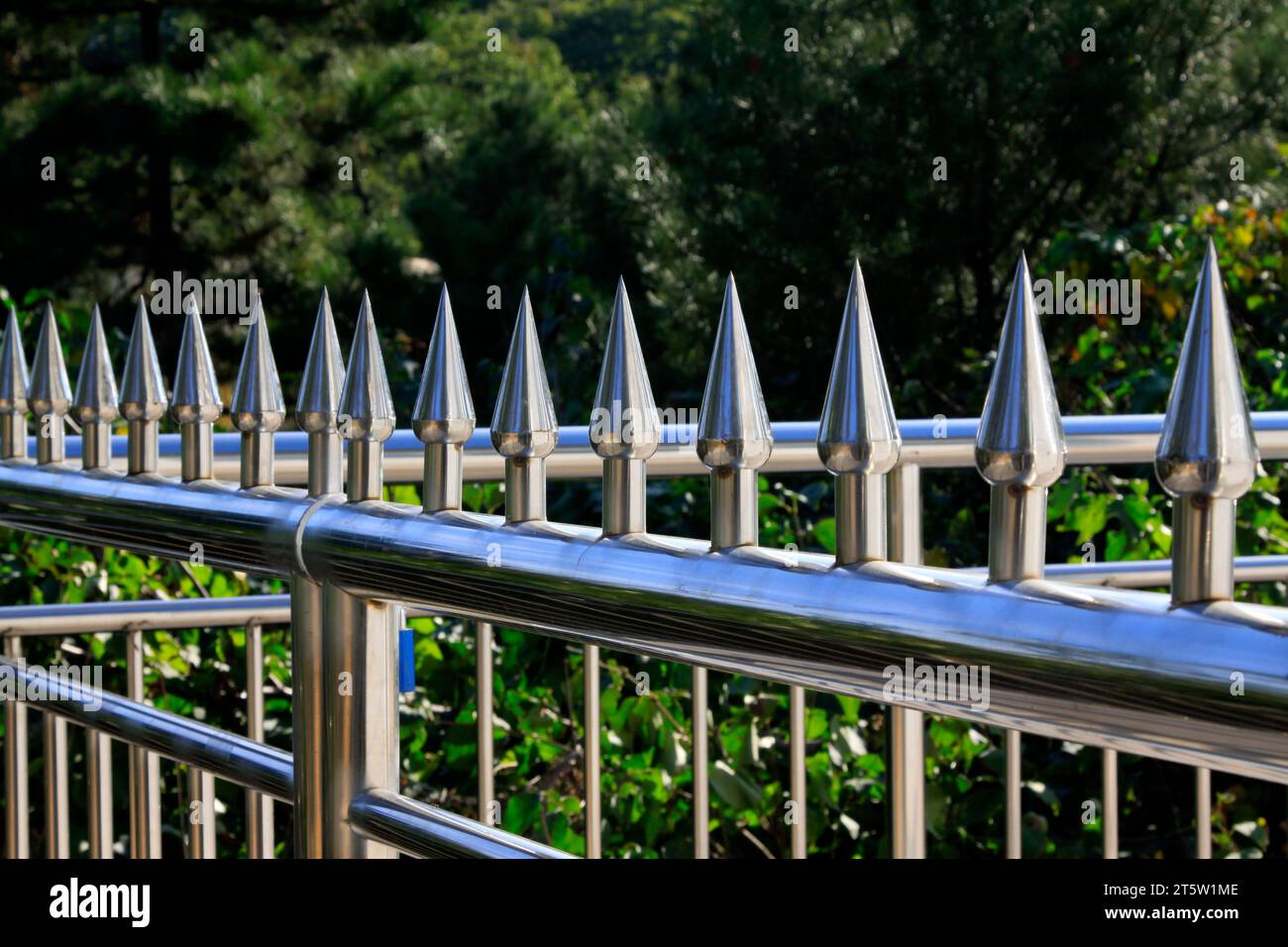 Stainless steel fence in the park Stock Photo - Alamy