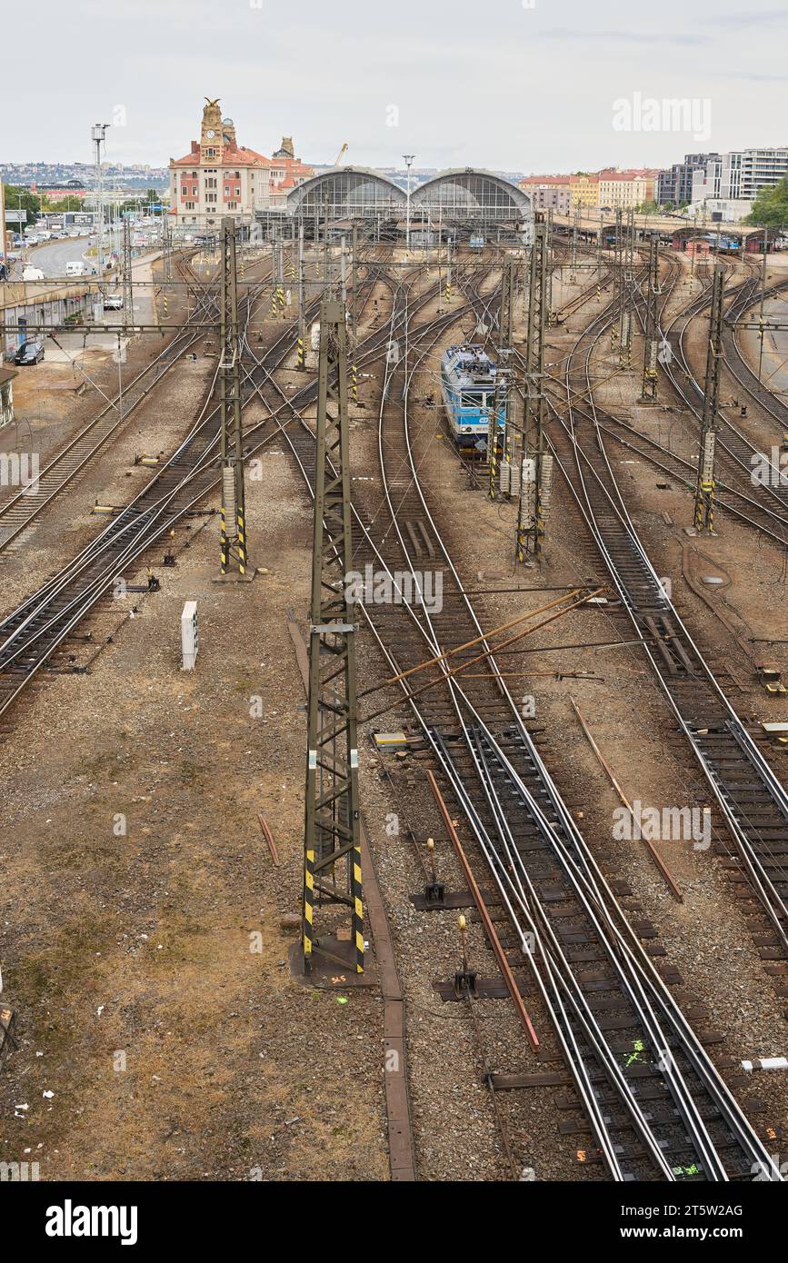 Railroad tracks and locomotive in front of the main station in Prague ...