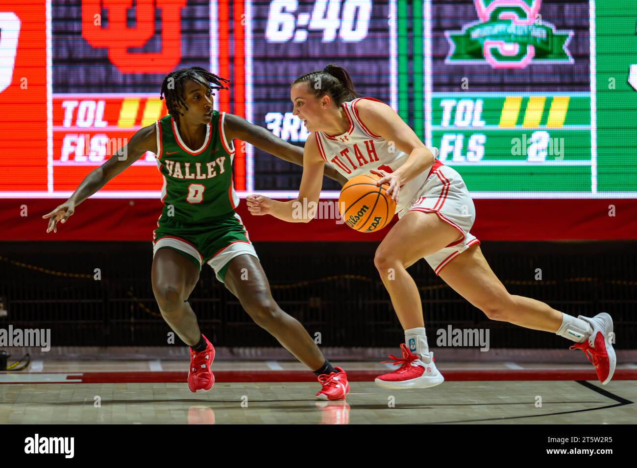 Utah guard Kennady McQueen (24) dribbles the basketball to the basket ...