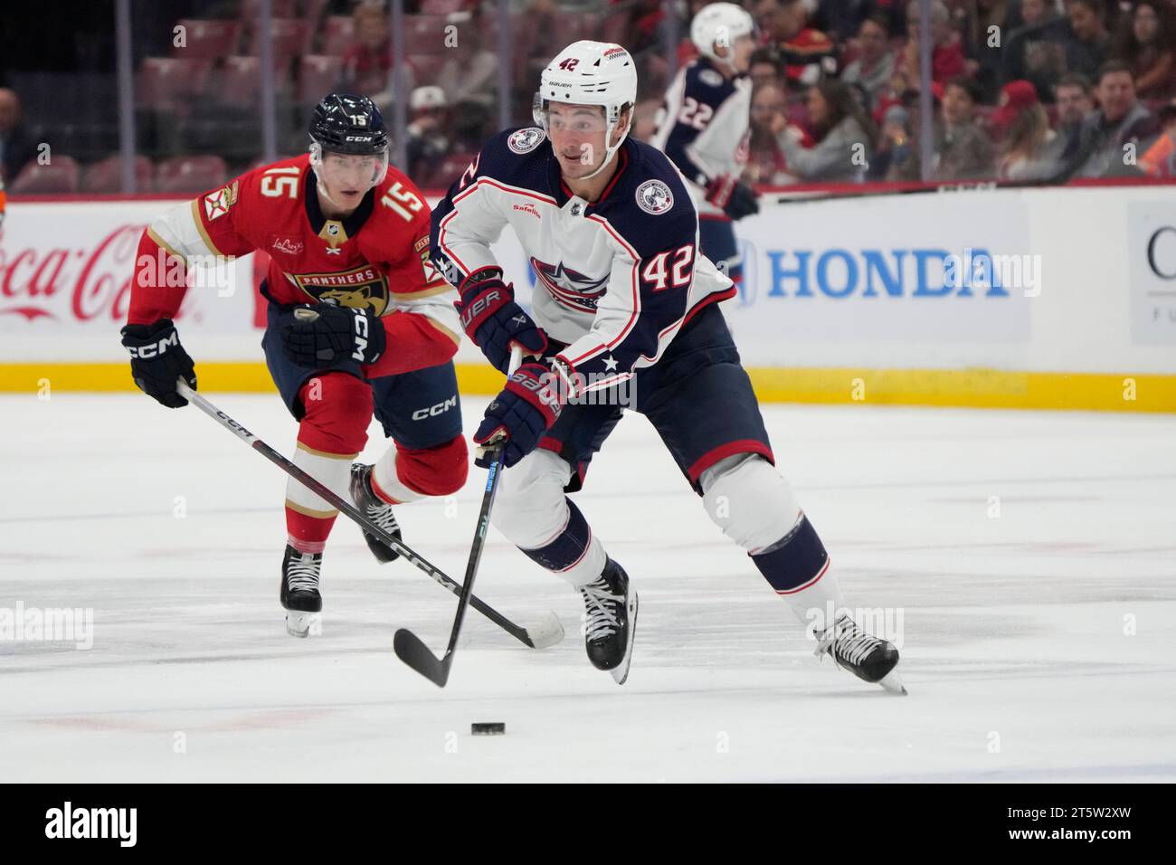 Columbus Blue Jackets center Alexandre Texier (42) takes the puck down ...
