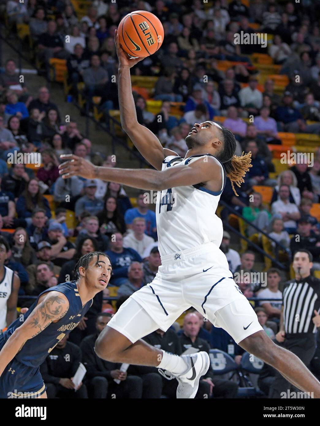 Utah State guard Josh Uduje (14) shoots the ball as South Dakota Mines ...