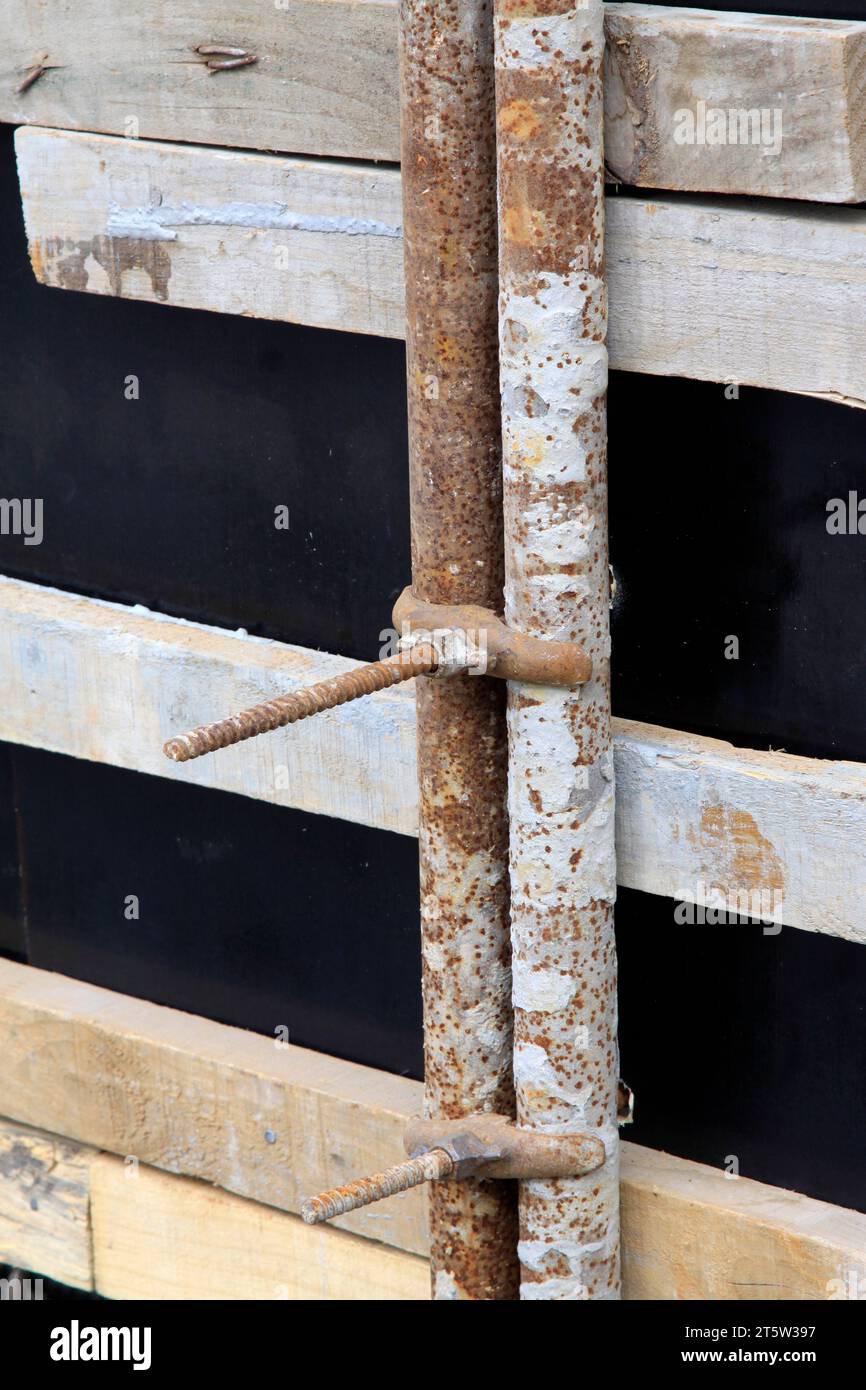 steel pipe fasteners and plank, closeup of photo Stock Photo - Alamy