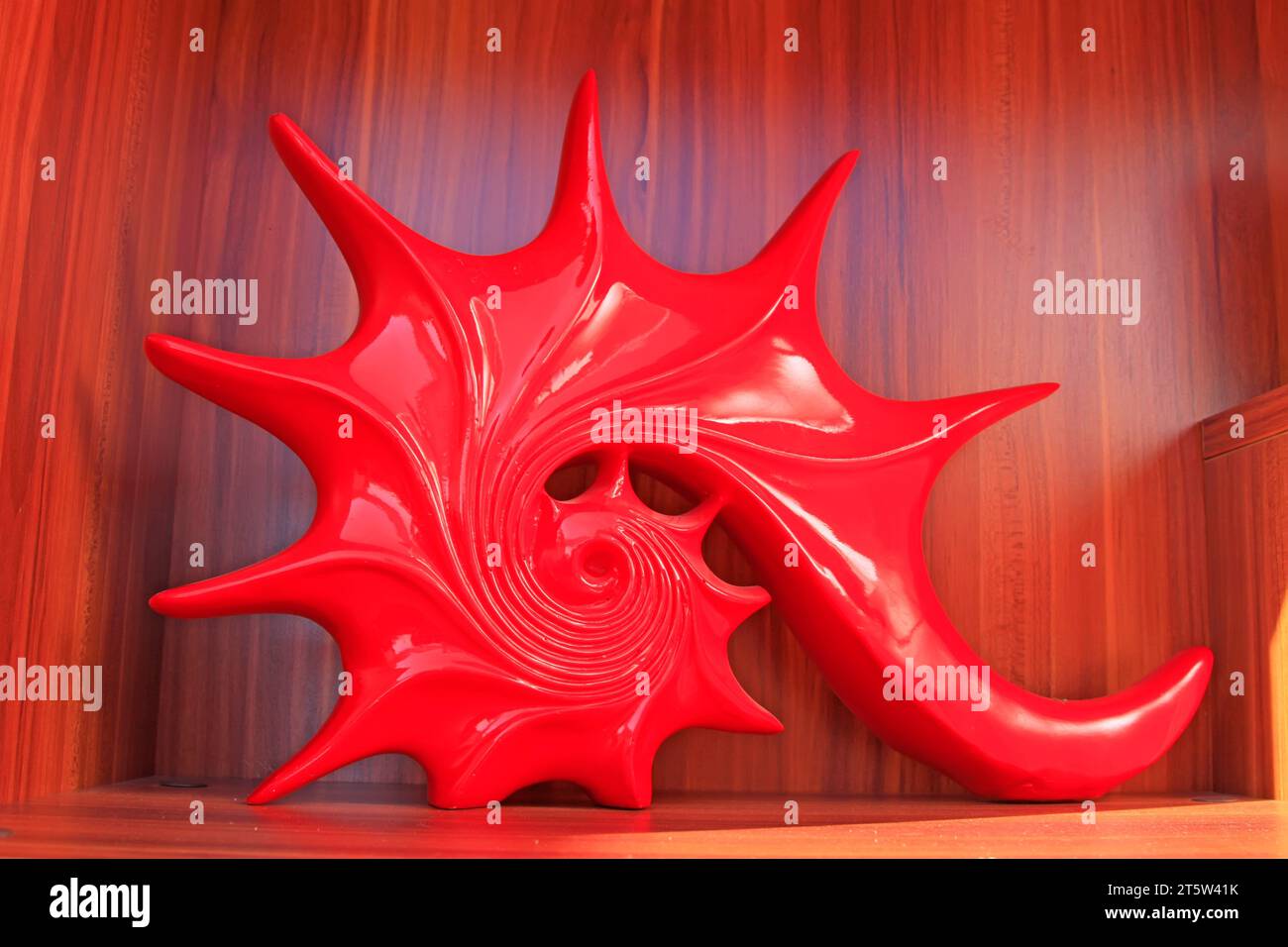 Red conch shape Stock Photo - Alamy
