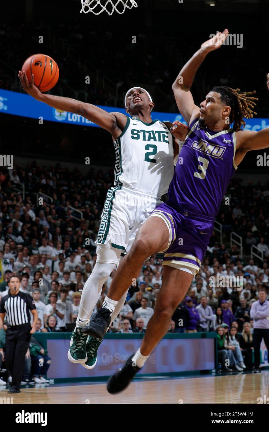 Michigan State's Tyson Walker (2) puts up a layup against James Madison ...