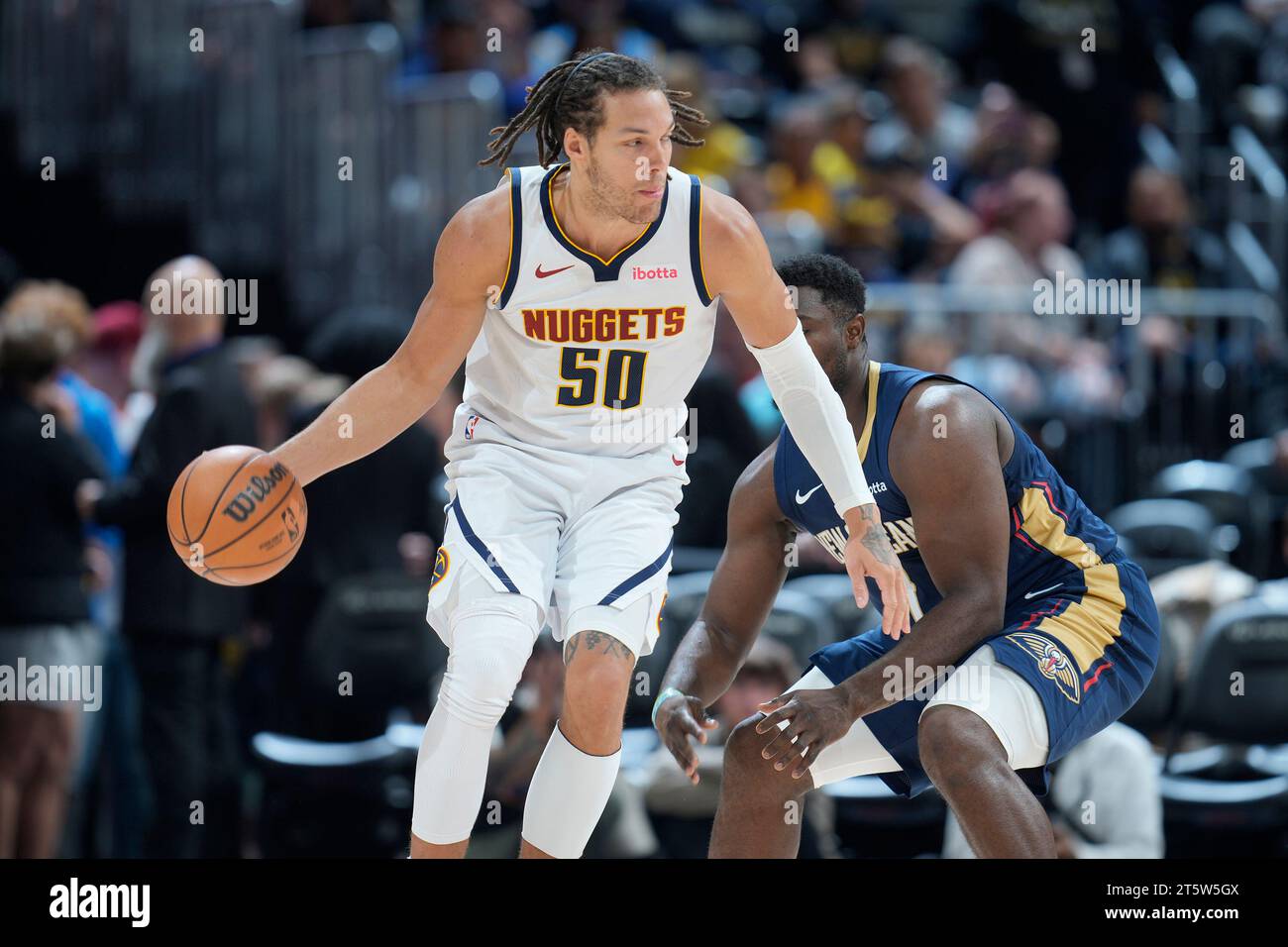 Denver Nuggets forward Aaron Gordon, left, drives past New Orleans ...