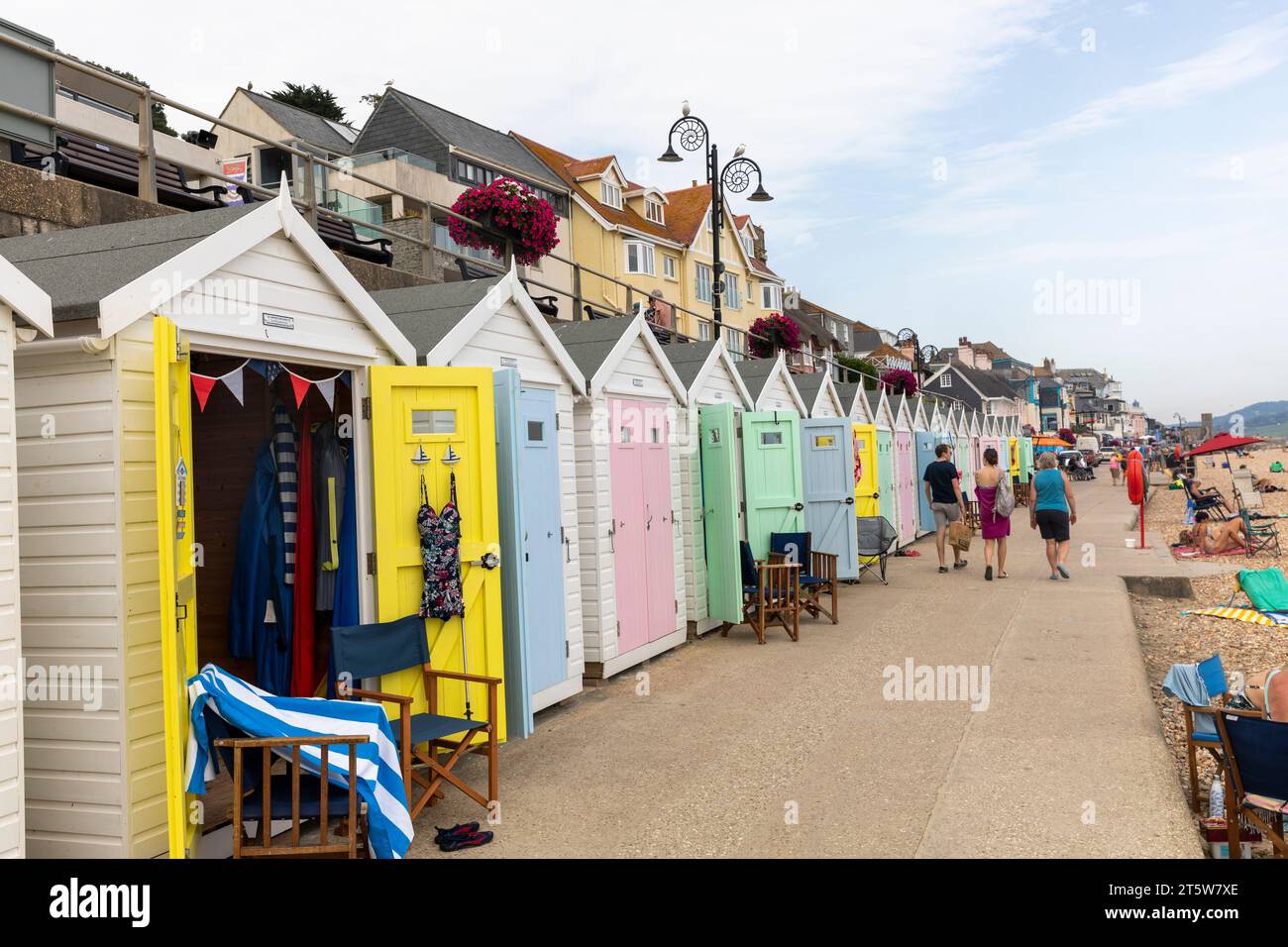 Lyme Regis Dorset, traditional English seafront beach huts painted in ...