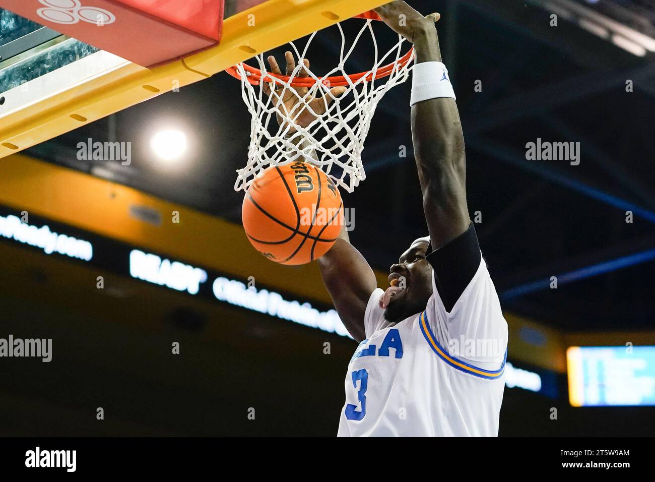 UCLA forward Adem Bona reacts after dunking the ball during the first ...