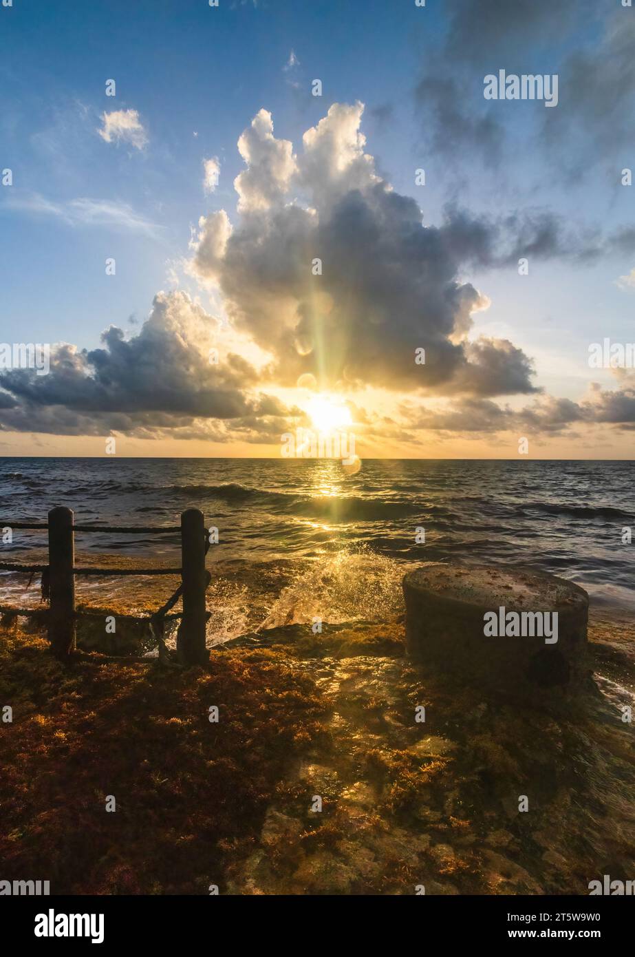 Sunrise over the Caribbean Sea, Tulum, Mexico. In the foreground ...