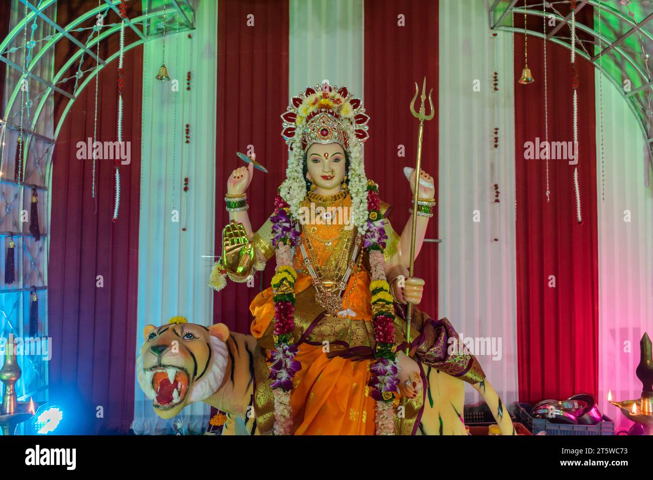 A beautiful idol of Maa Durga being worshipped at a pandal during ...