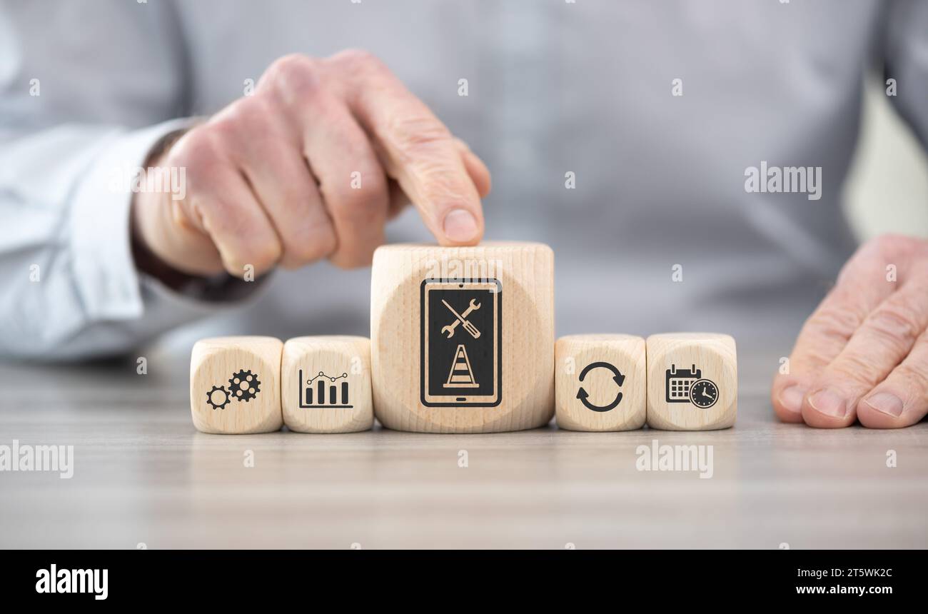 Wooden blocks with symbol of system maintenance concept Stock Photo - Alamy