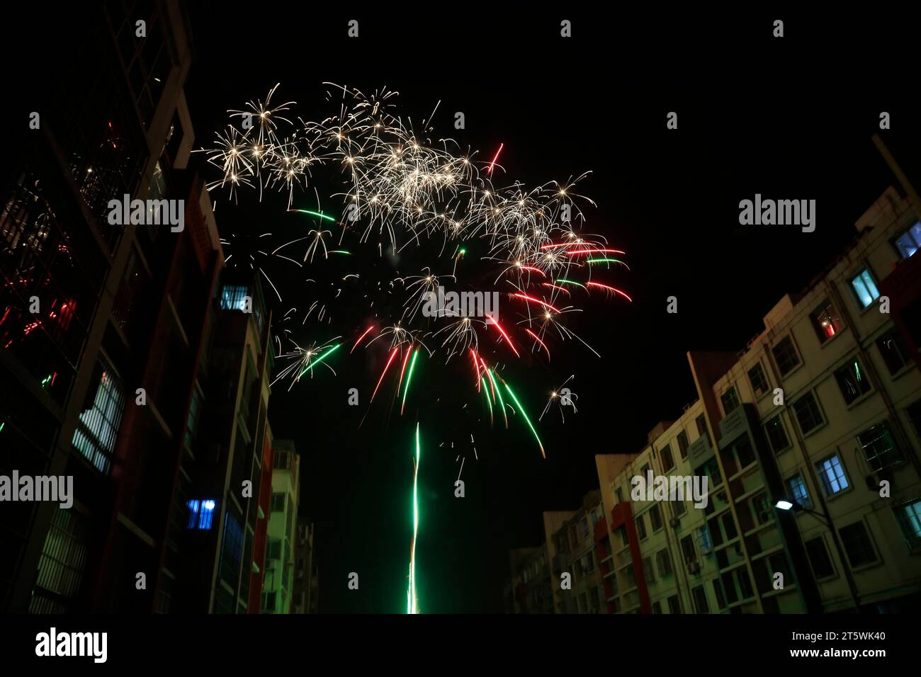 Fireworks over buildings Stock Photo - Alamy