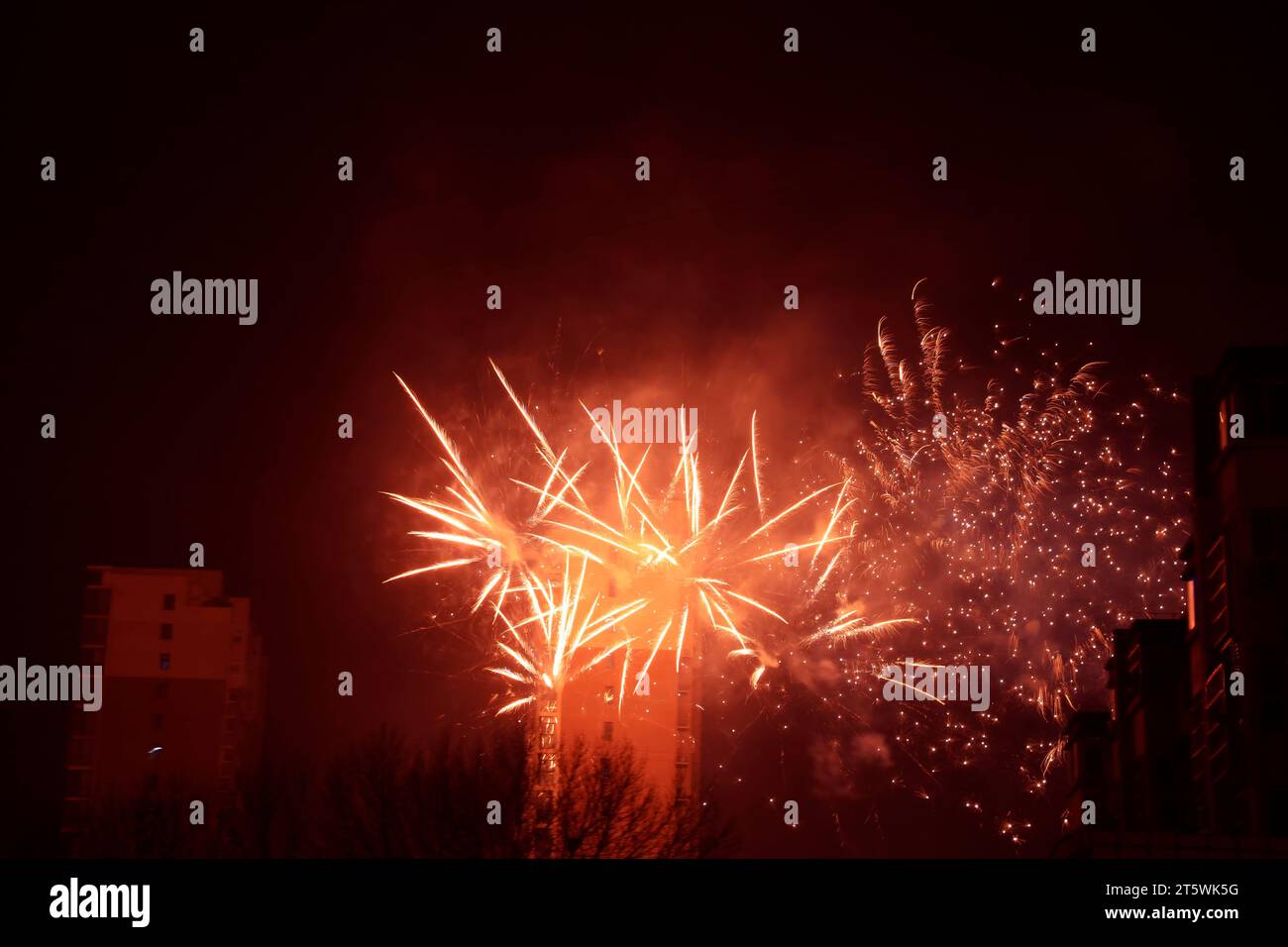 Fireworks over buildings Stock Photo - Alamy