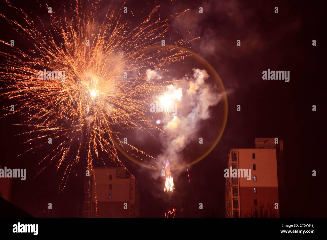 Fireworks over buildings Stock Photo - Alamy