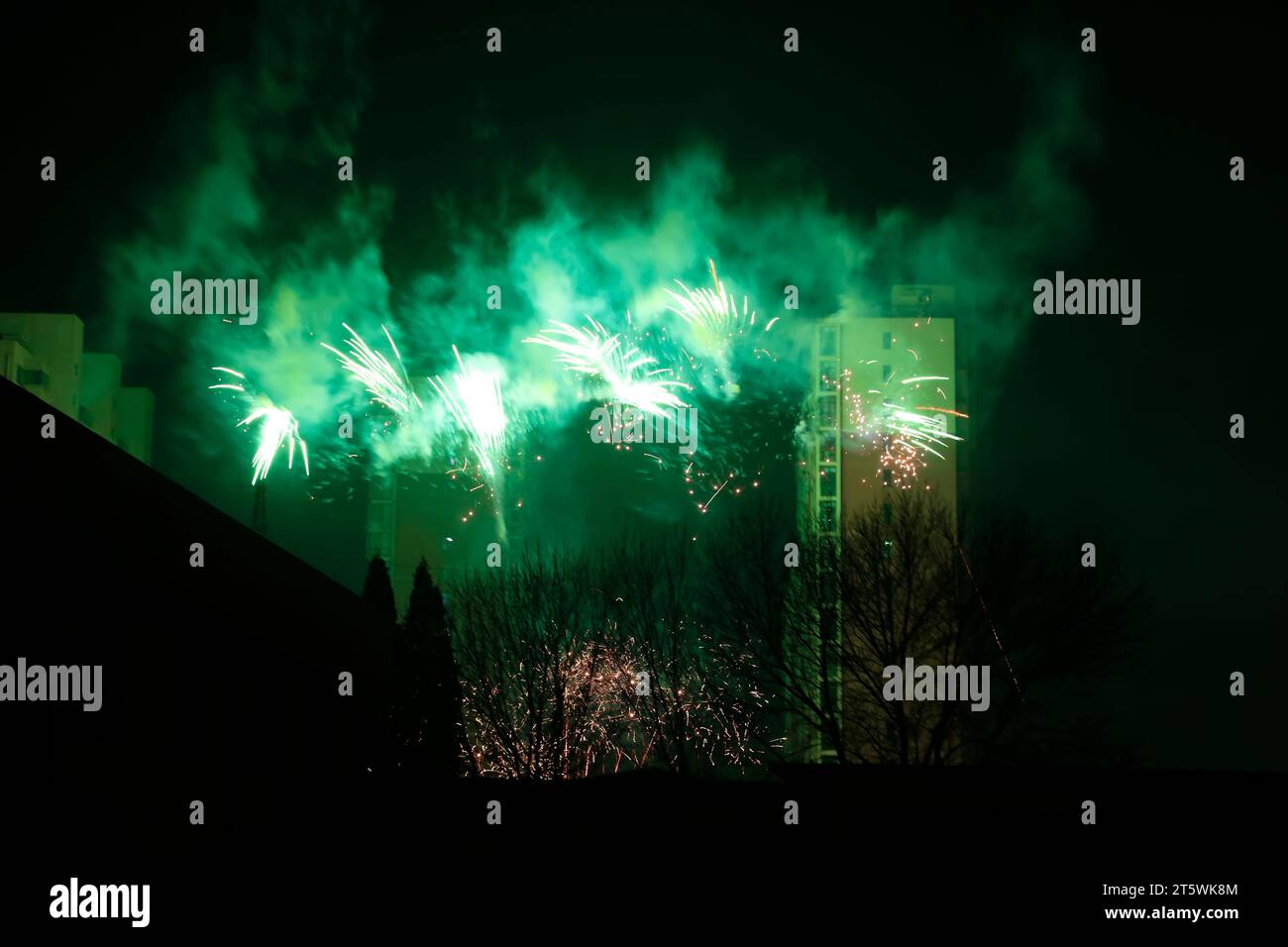 Fireworks over buildings Stock Photo - Alamy