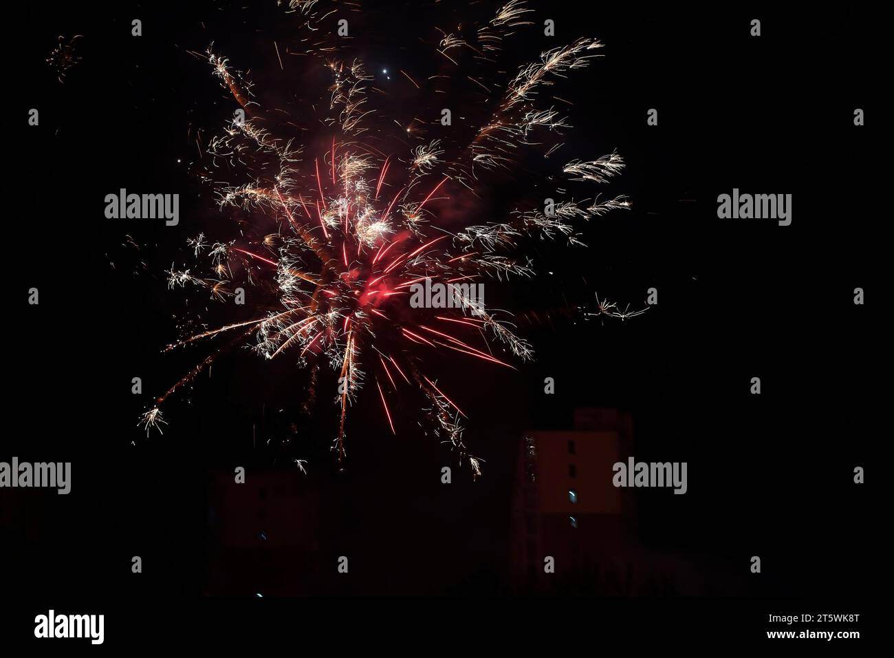 Fireworks over buildings Stock Photo - Alamy