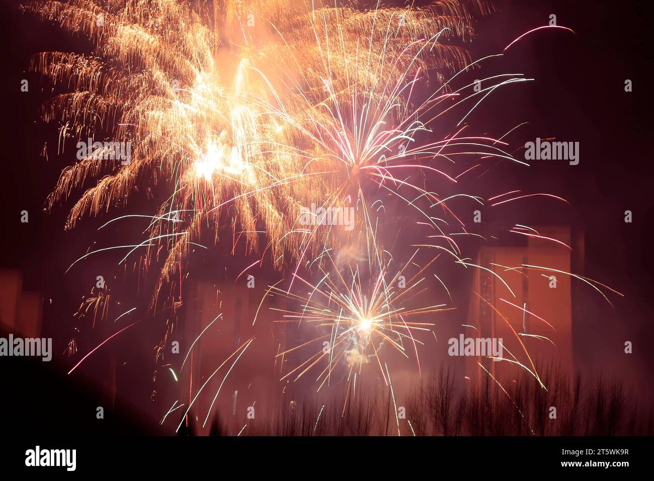 Fireworks over buildings Stock Photo - Alamy