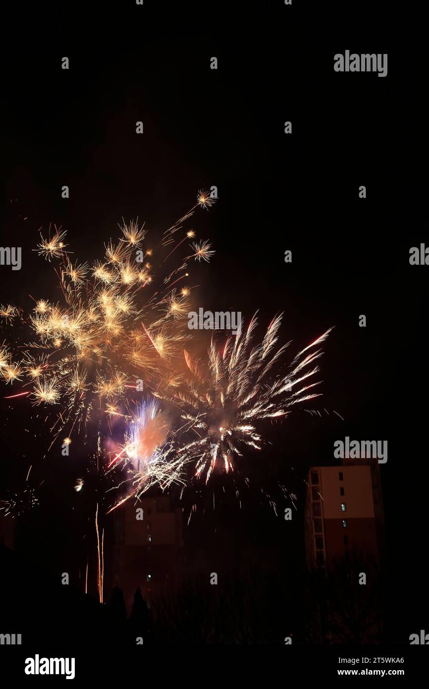 Fireworks over buildings Stock Photo - Alamy