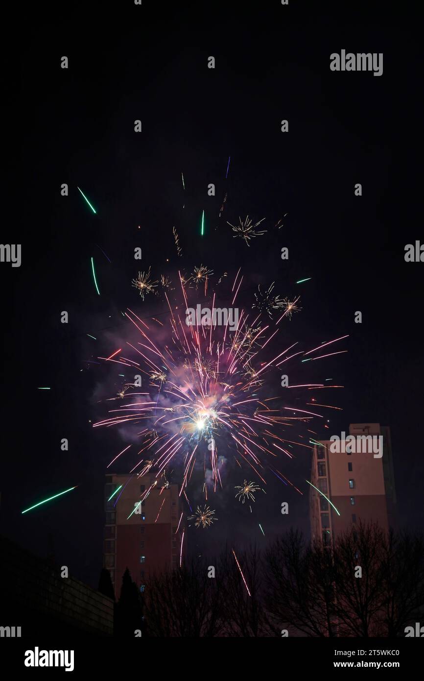 Fireworks over buildings Stock Photo - Alamy