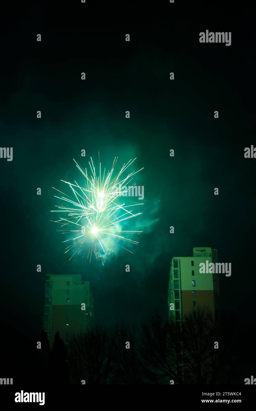 Fireworks over buildings Stock Photo - Alamy