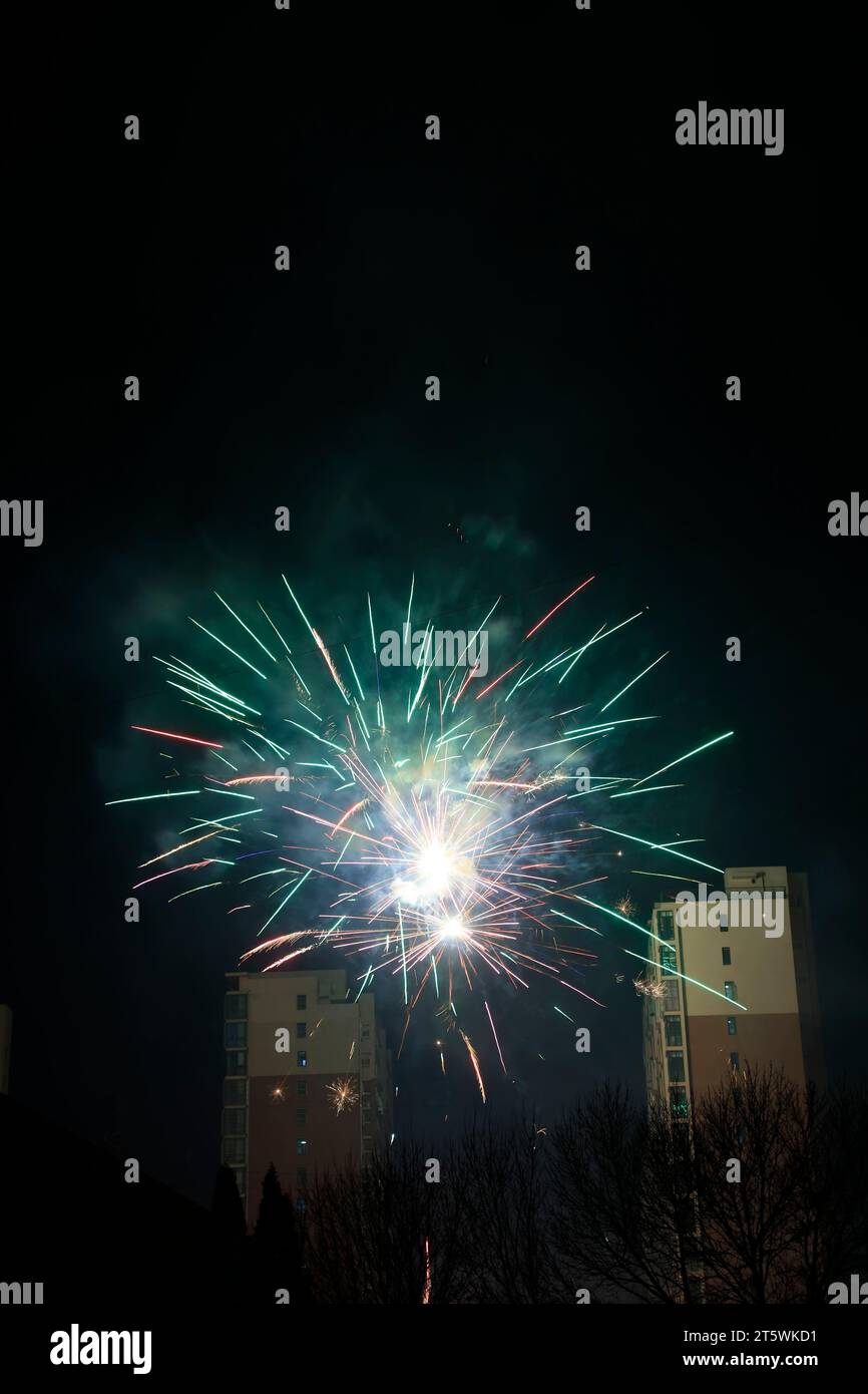 Fireworks over buildings Stock Photo - Alamy