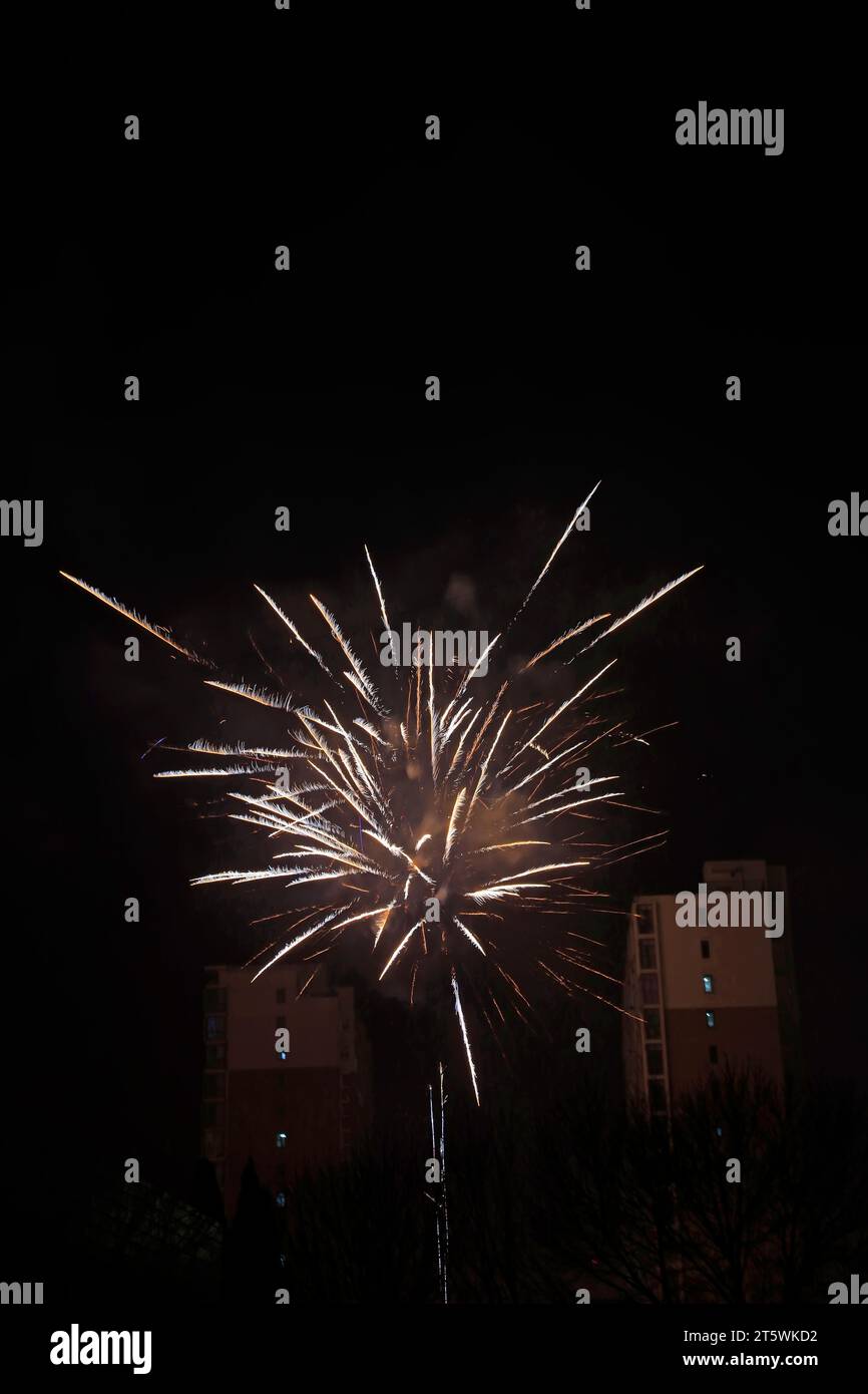 Fireworks over buildings Stock Photo - Alamy