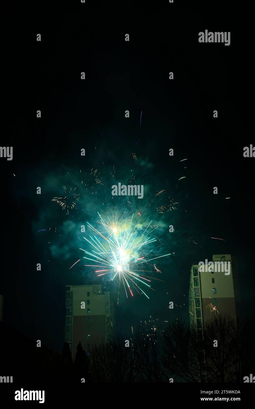 Fireworks over buildings Stock Photo - Alamy