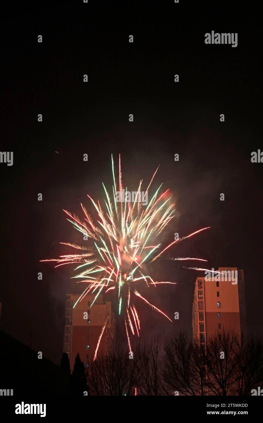 Fireworks over buildings Stock Photo - Alamy