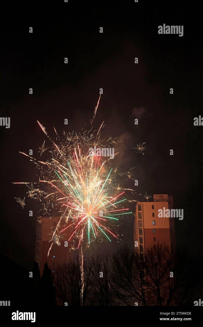 Fireworks over buildings Stock Photo - Alamy