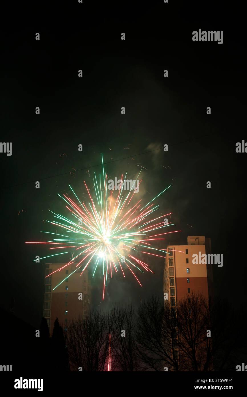 Fireworks over buildings Stock Photo - Alamy