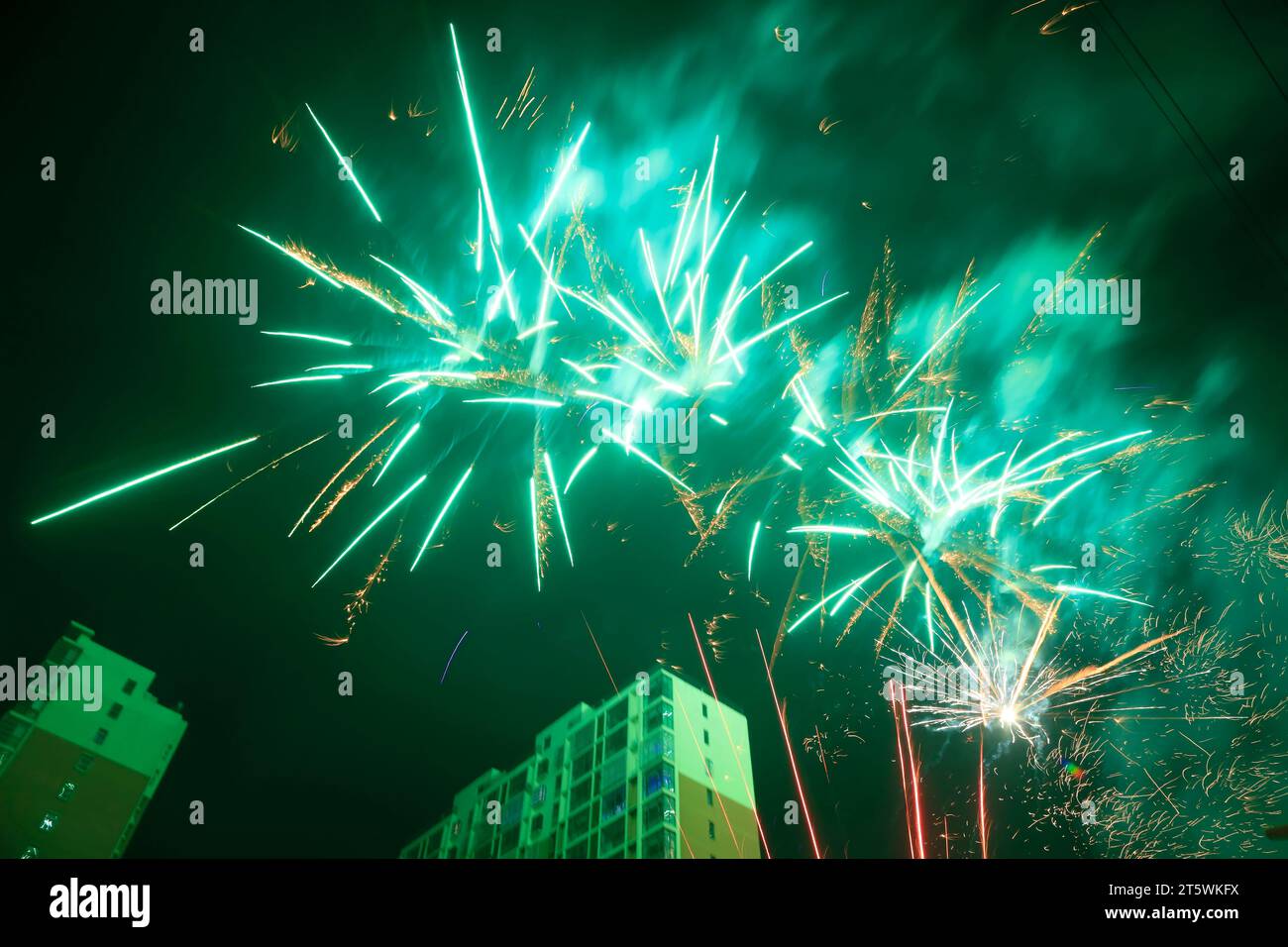 Fireworks over buildings Stock Photo - Alamy