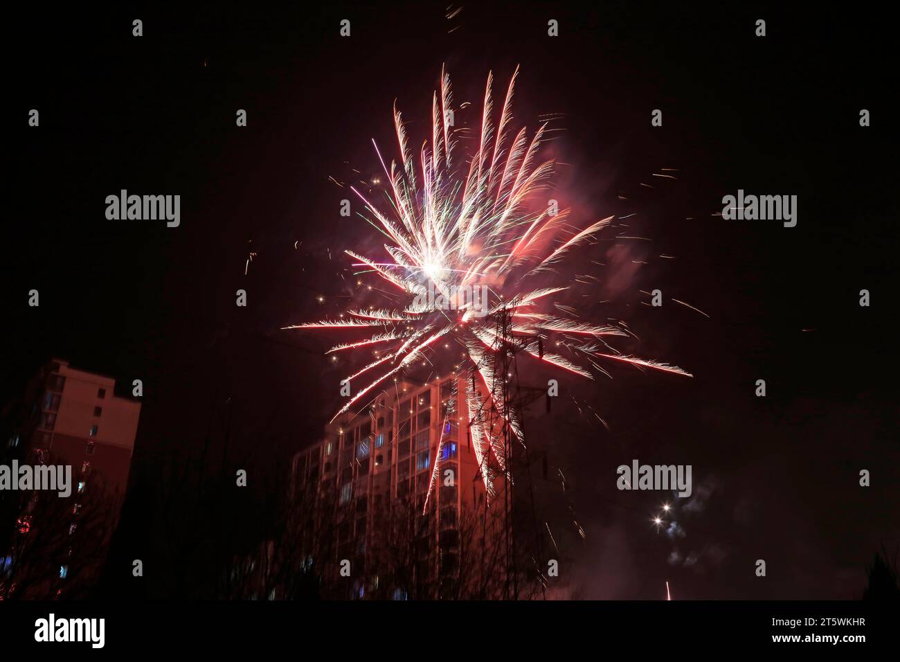 Fireworks over buildings Stock Photo - Alamy