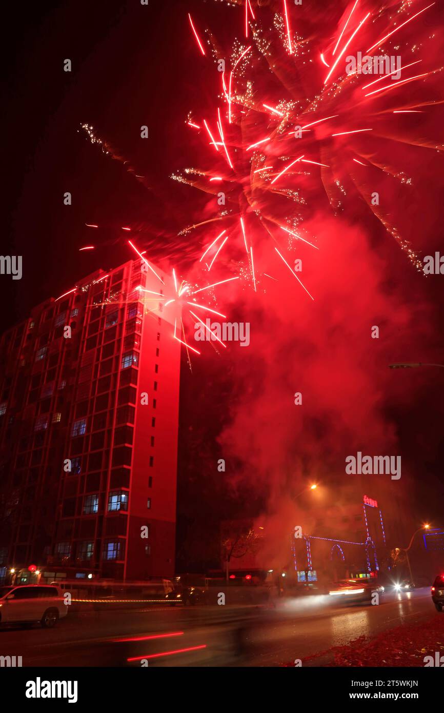 Fireworks over buildings Stock Photo - Alamy