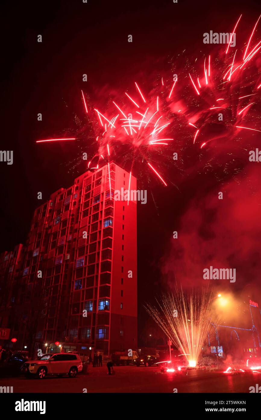 Fireworks over buildings Stock Photo - Alamy