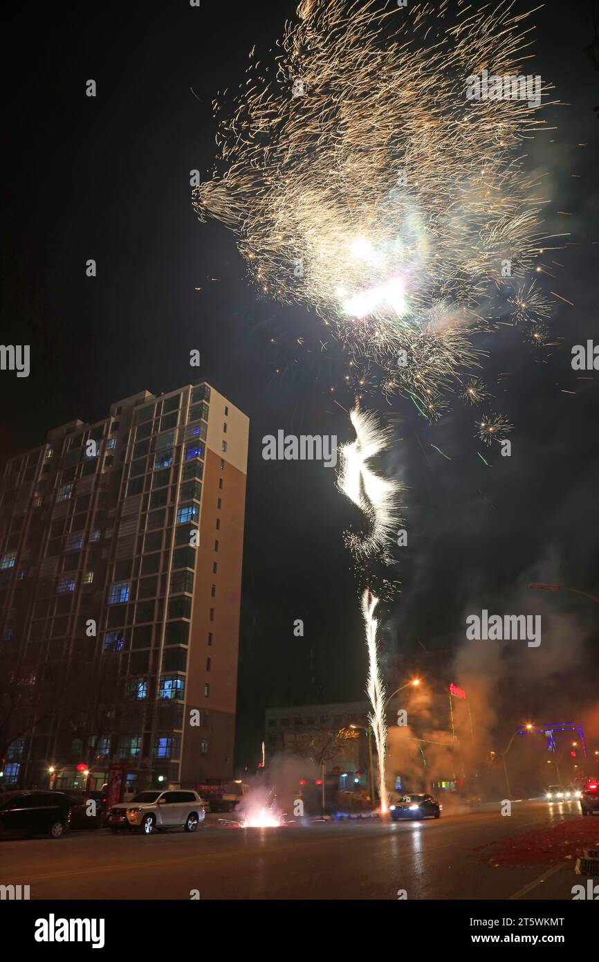 Fireworks over buildings Stock Photo - Alamy