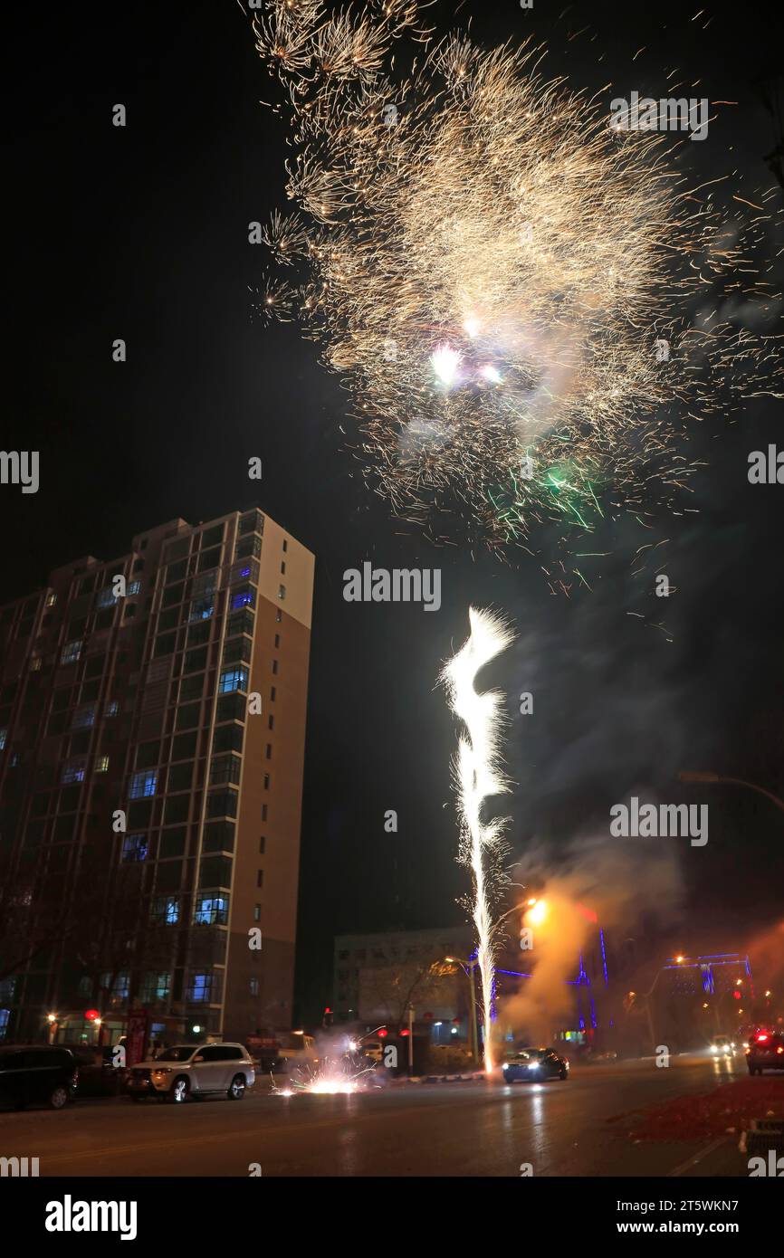 Fireworks over buildings Stock Photo - Alamy