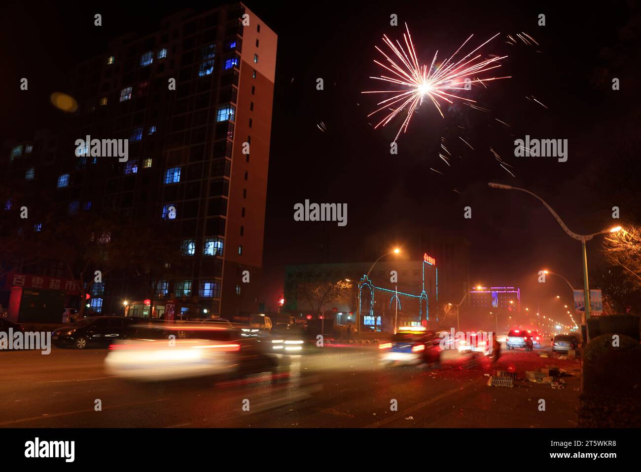 Fireworks over buildings Stock Photo - Alamy