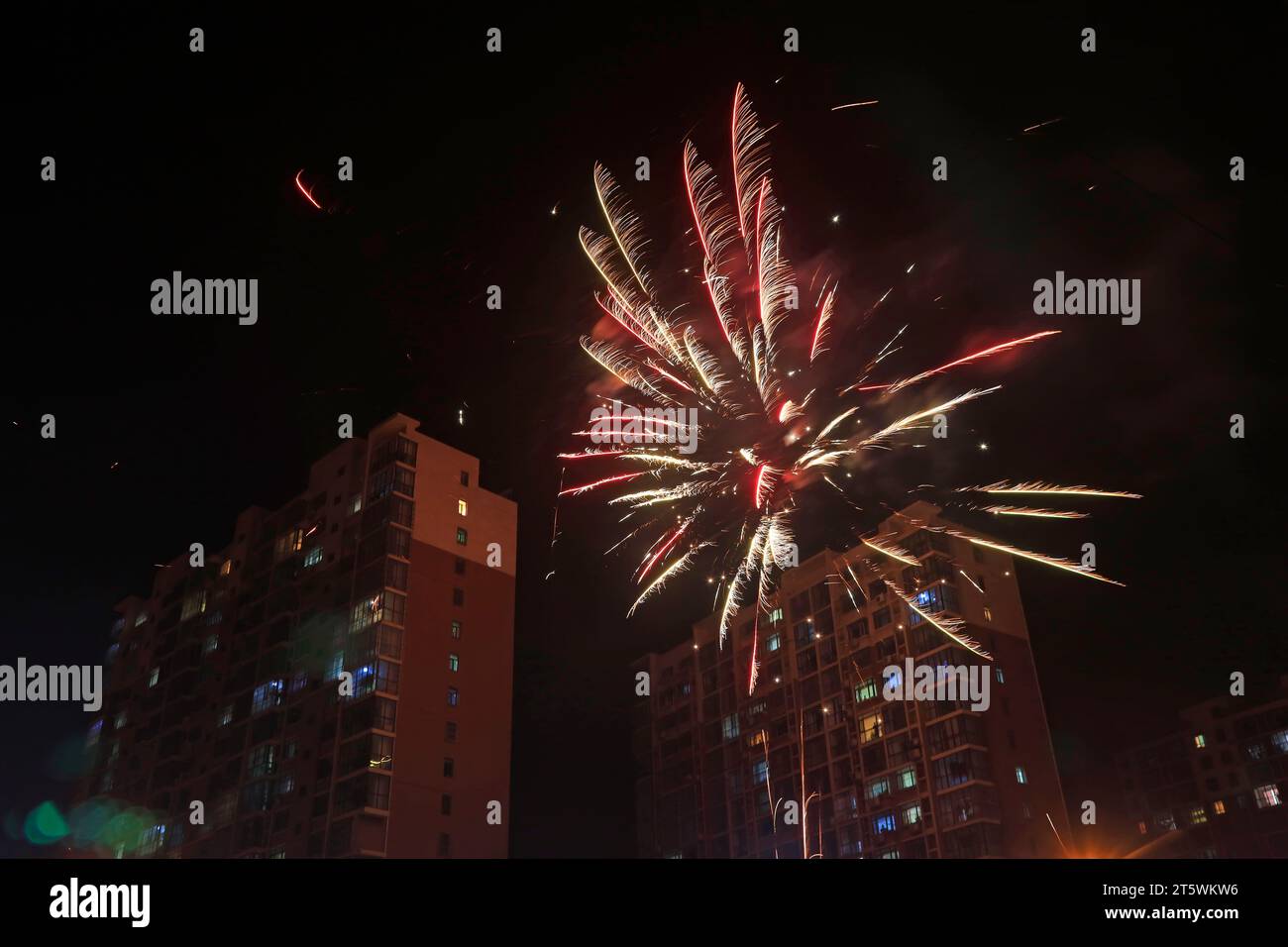 Fireworks over buildings Stock Photo - Alamy