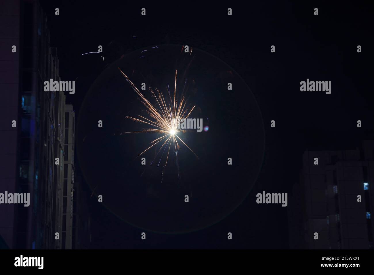 Fireworks over buildings Stock Photo - Alamy