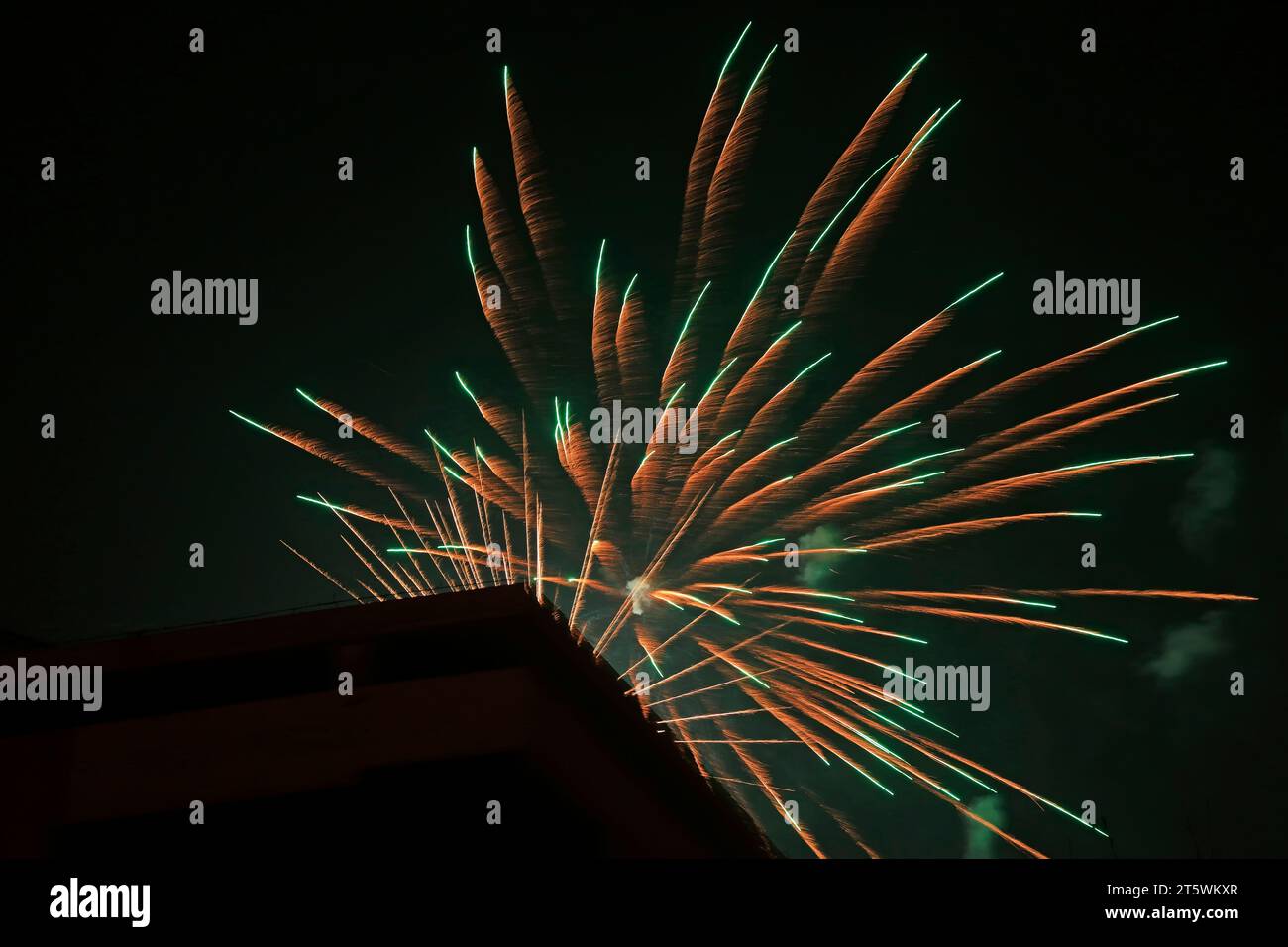 Fireworks over buildings Stock Photo - Alamy