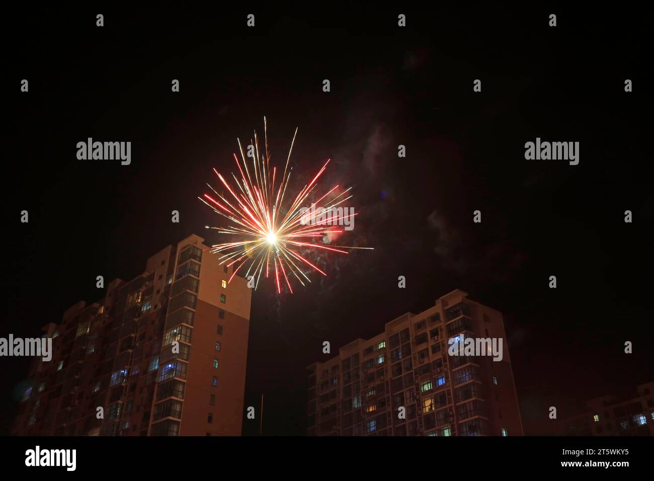 Fireworks over buildings Stock Photo - Alamy