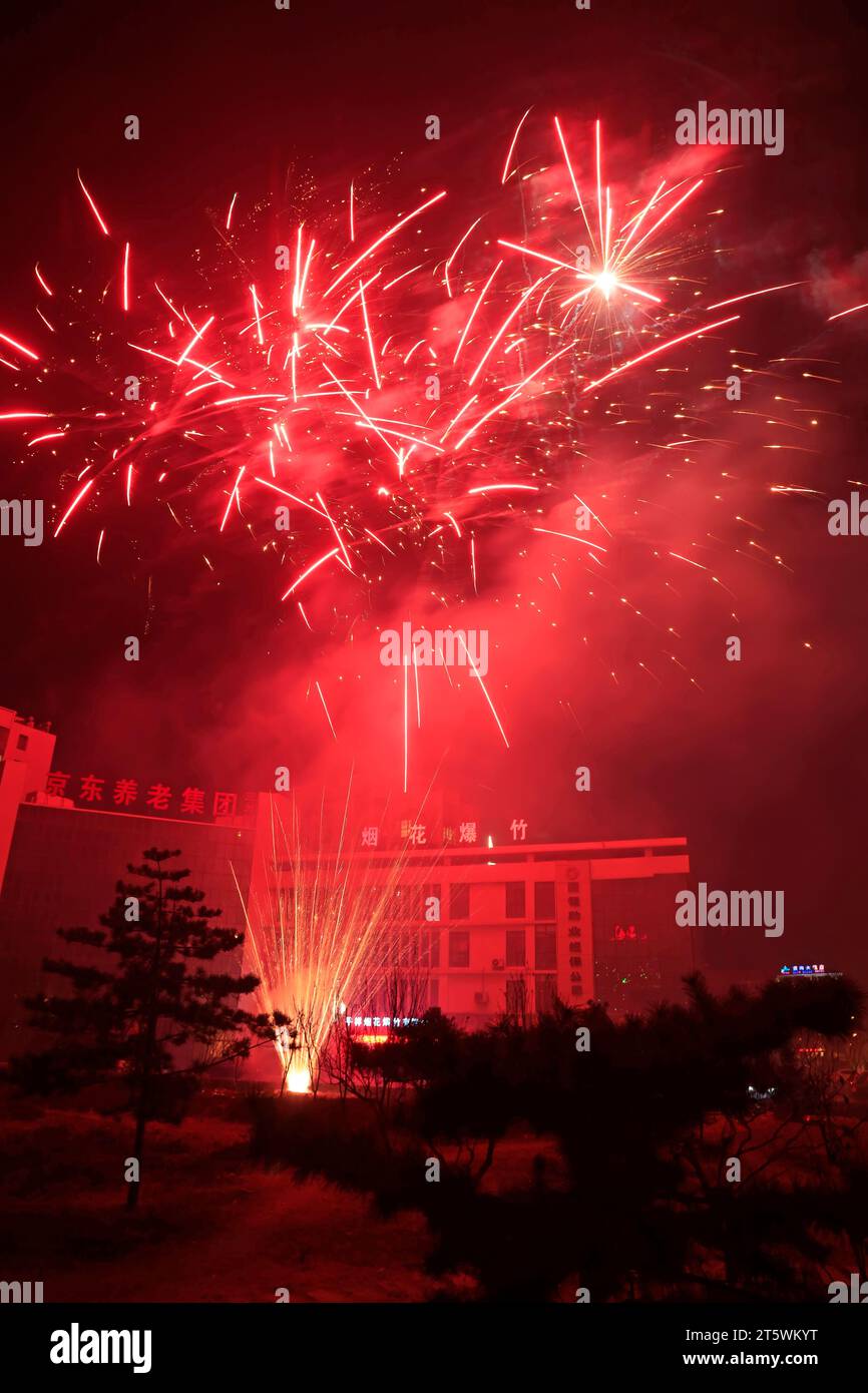 Fireworks over buildings Stock Photo - Alamy