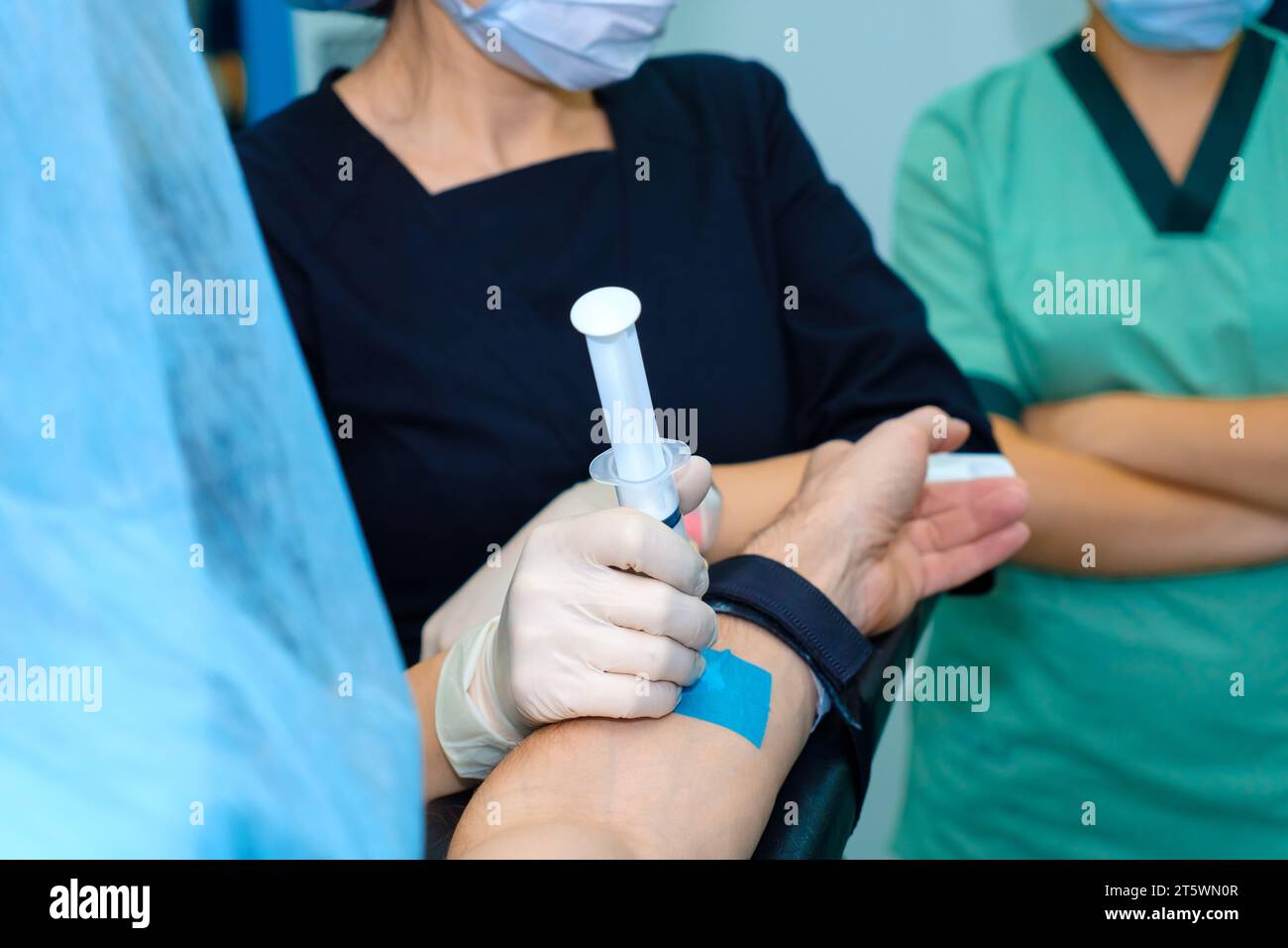 Intravenous administration of anesthesia with a syringe through a ...