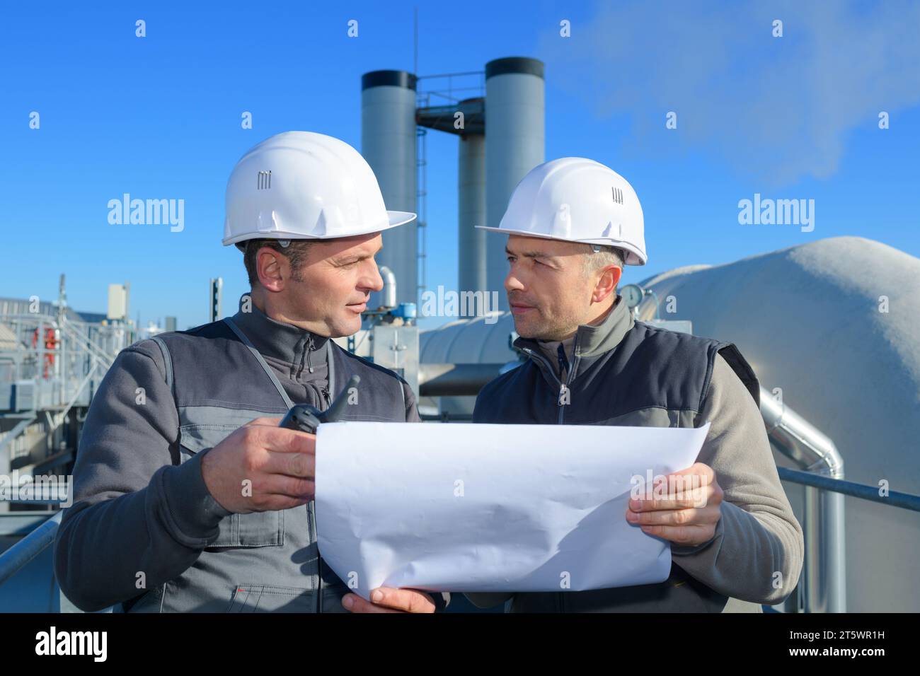 engineering technicians are discussion the companys employees Stock ...