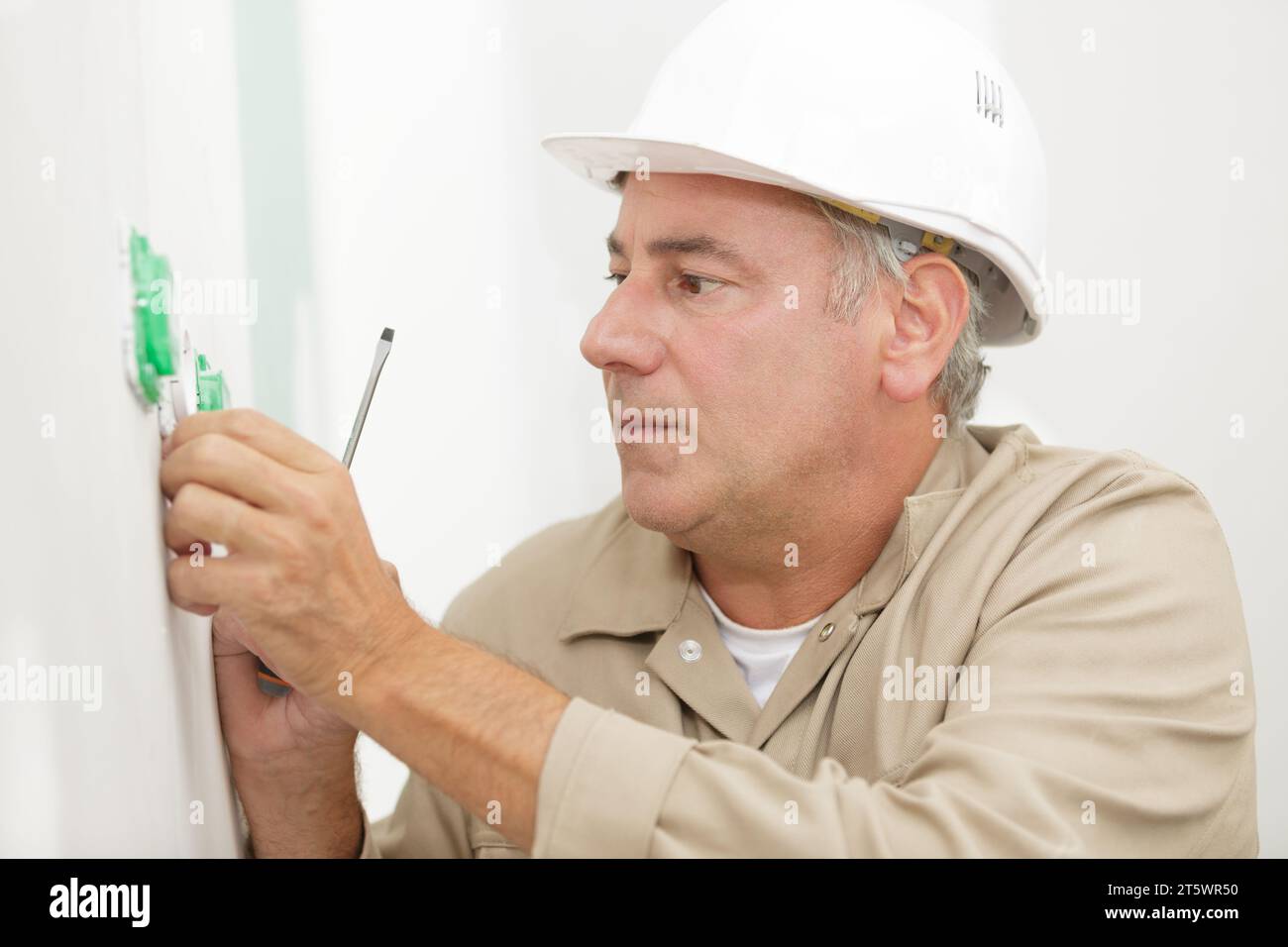 repair electricity socket and man concept Stock Photo - Alamy