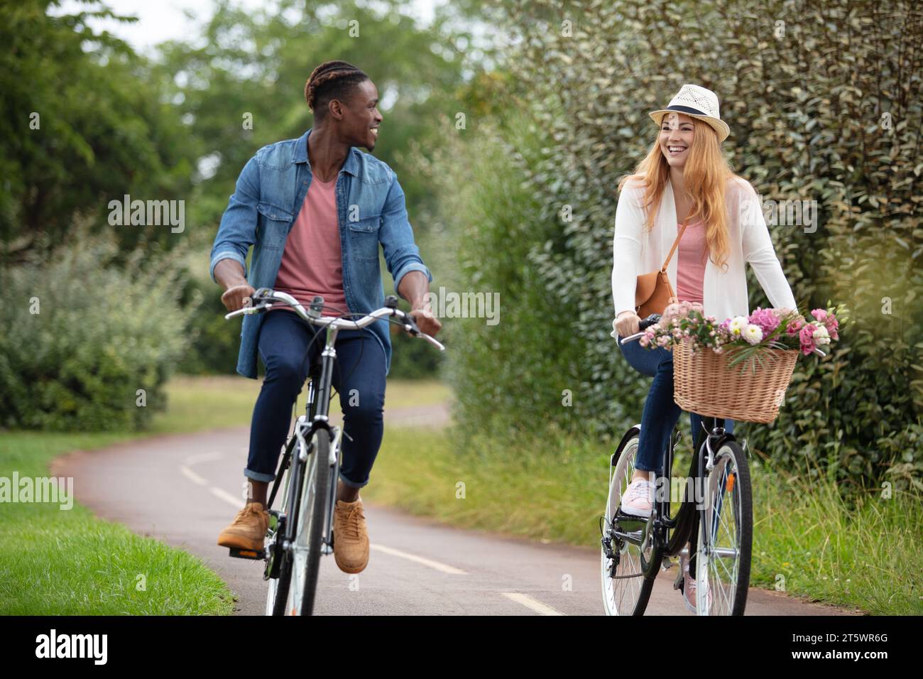 couple cycling on a flat cycle path Stock Photo - Alamy