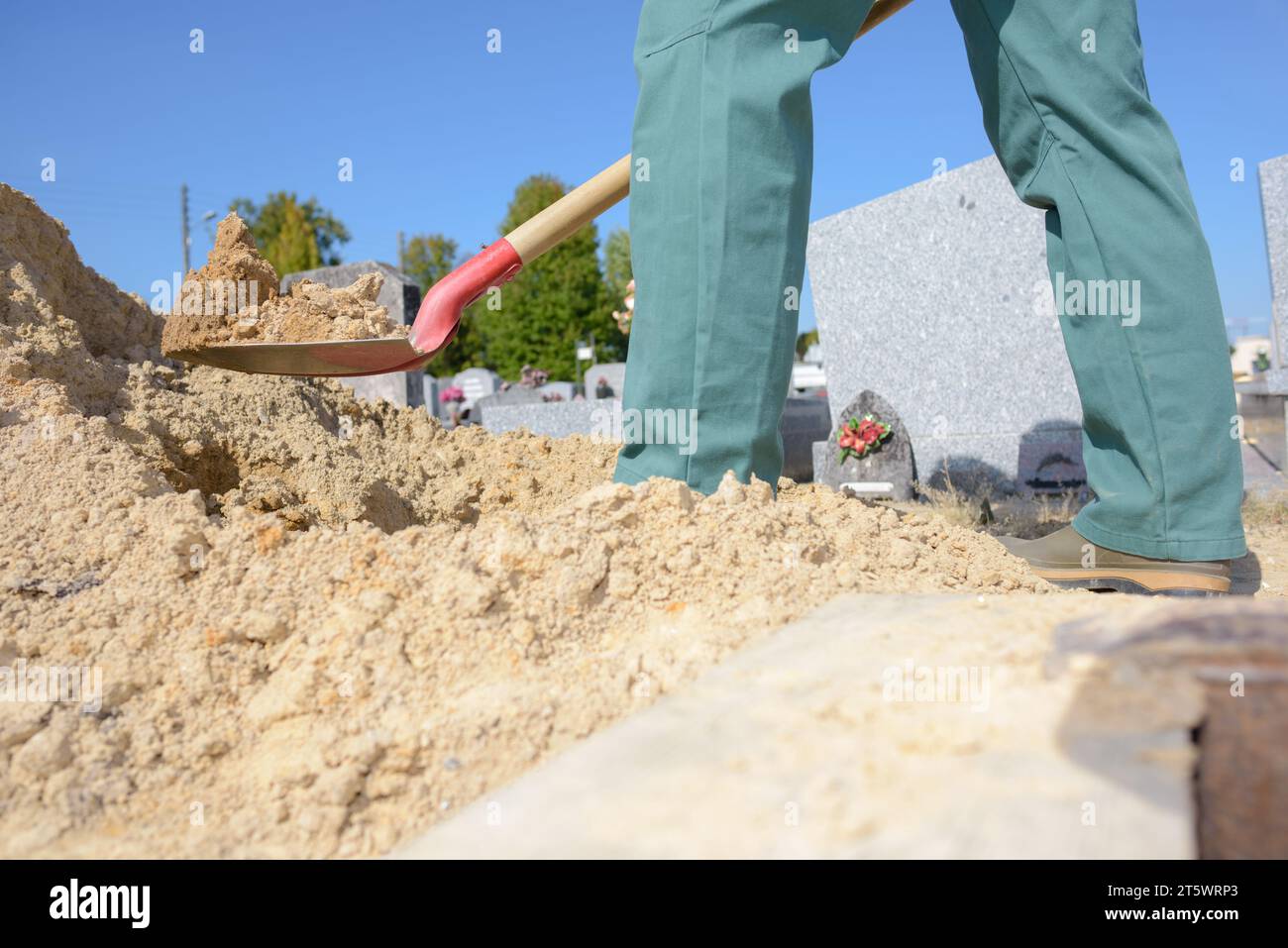 portrait of man digging a grave Stock Photo - Alamy