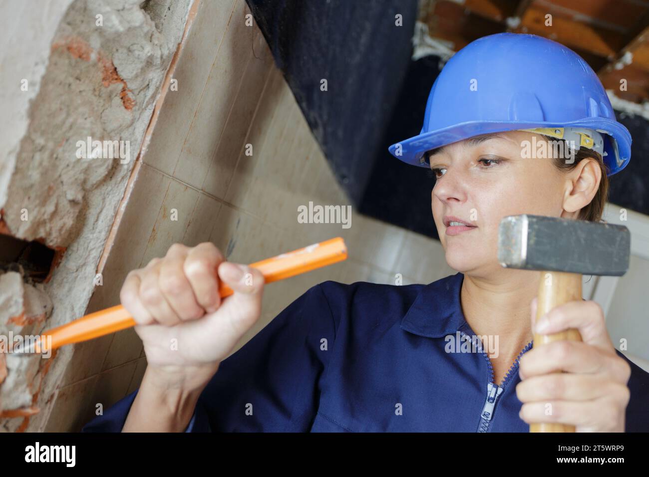 beautiful woman breaking a wall Stock Photo - Alamy