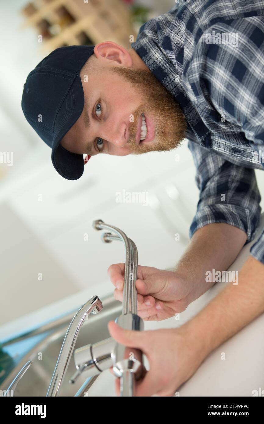 Man fixing sink pipe hi-res stock photography and images - Alamy