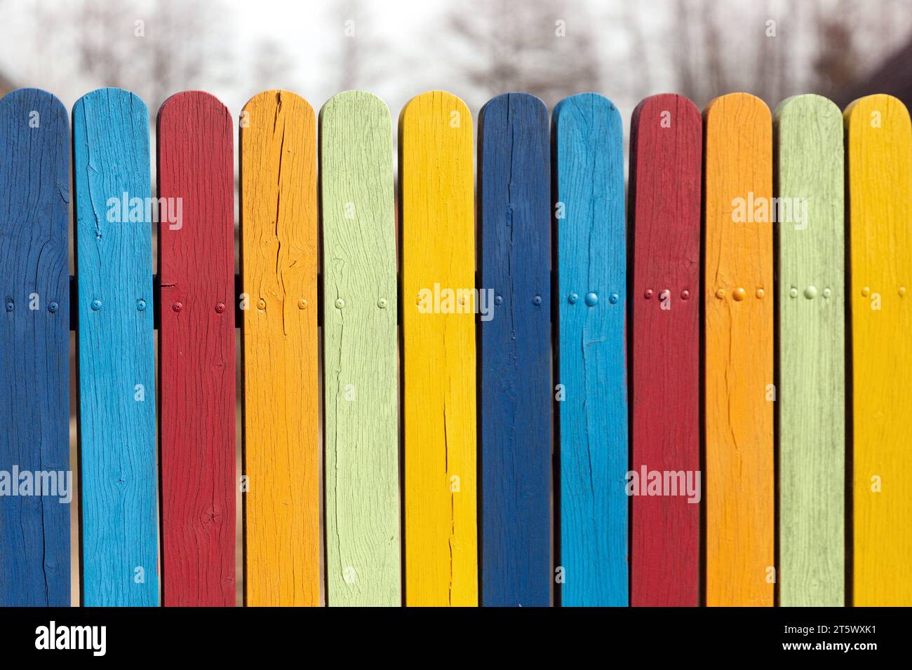 Colorful fence with boards painted in different colors Stock Photo - Alamy
